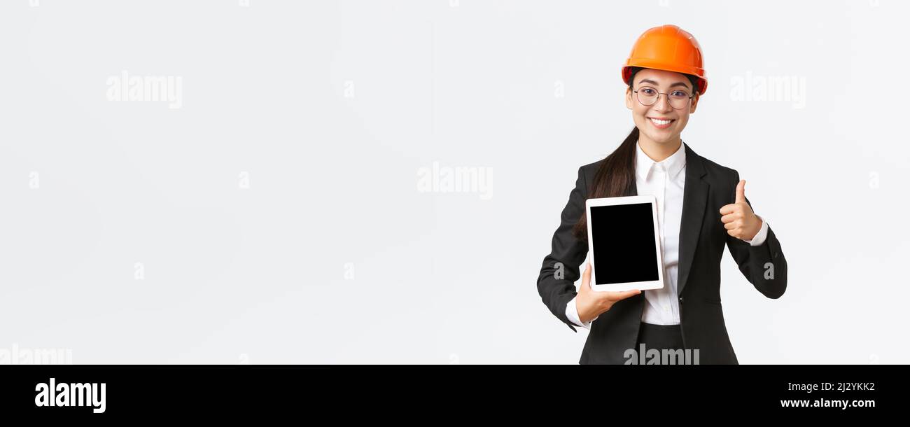 Professional smiling asian female construction manager, factory ...