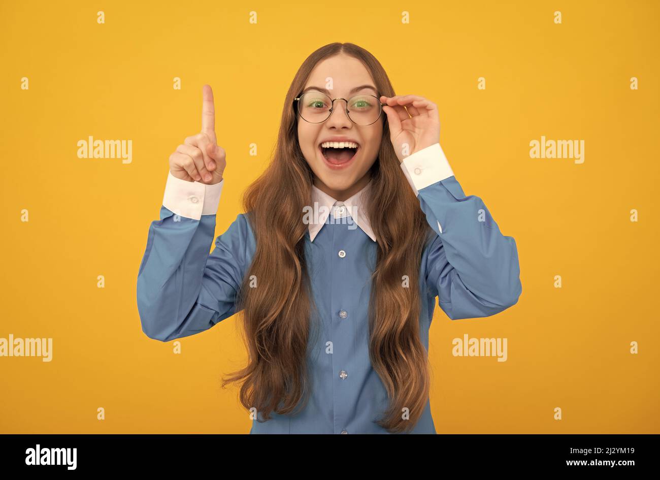 Genius idea. Girl genius with raised finger. Child prodigy in ...