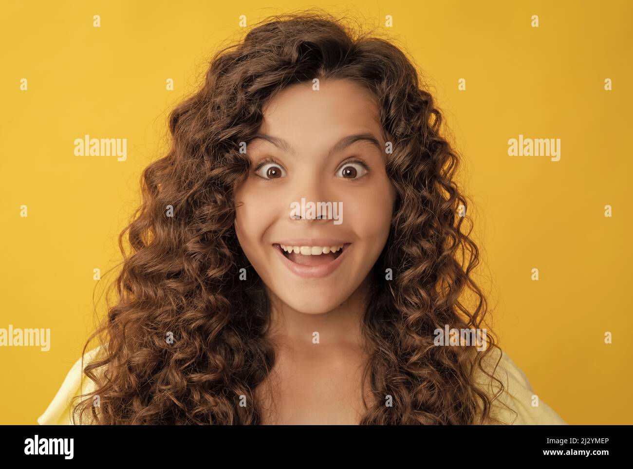 amazed teen beauty hairstyle. female fashion model. frizzy hair curl ...