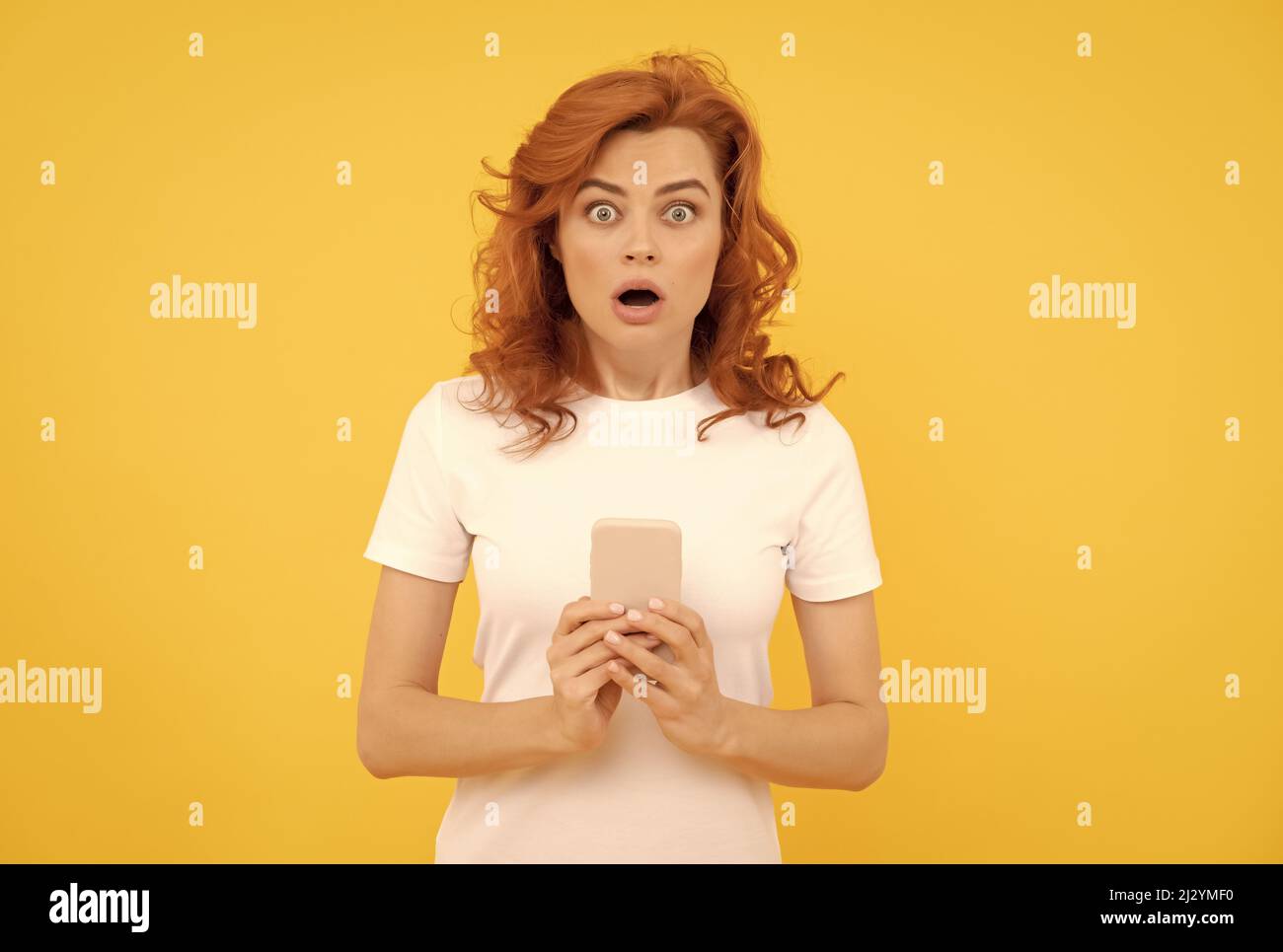 surprised woman chatting in smartphone or make online shopping on ...
