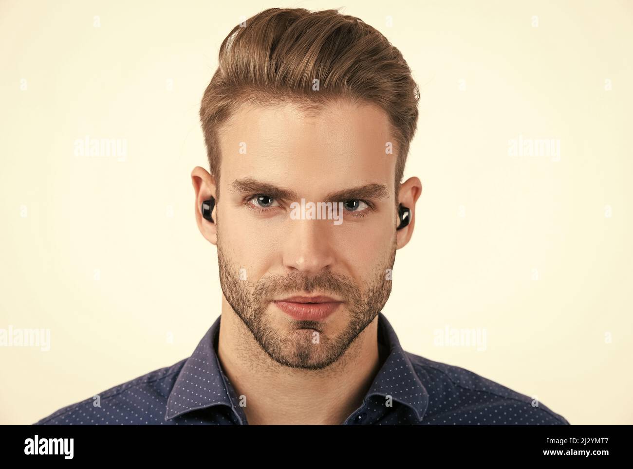 handsome unshaven man with wireless bluetooth earphones isolated on ...