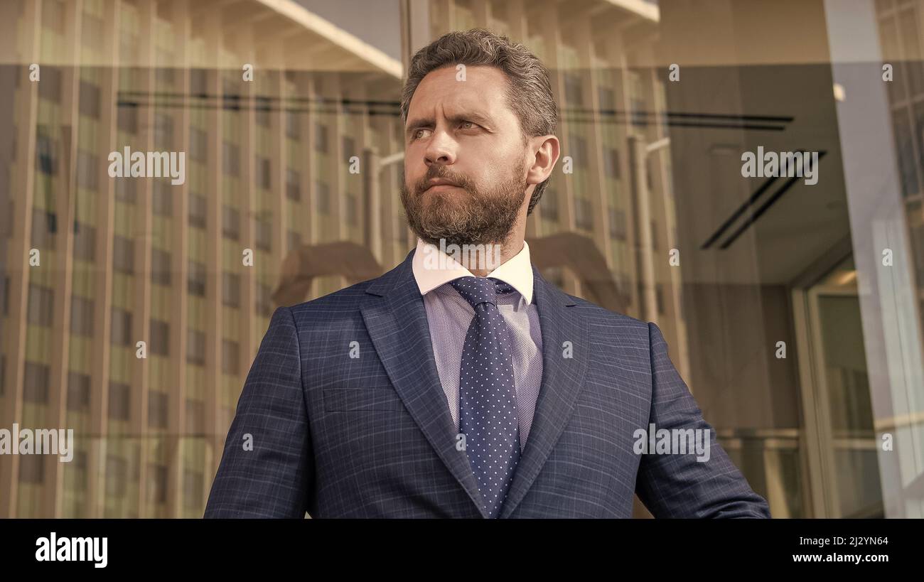 successful man in businesslike suit. manager executive outside the ...