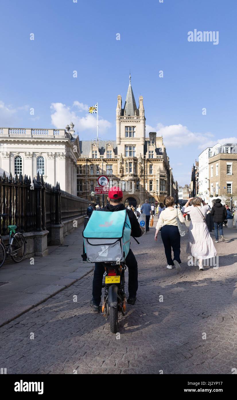 Deliveroo rider; Deliveroo cyclist delivering food, back view ...