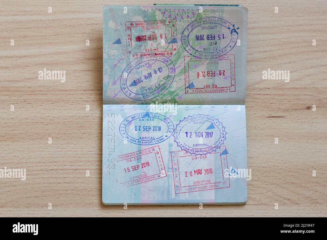 Immigration entry stamps on passport pages Stock Photo - Alamy