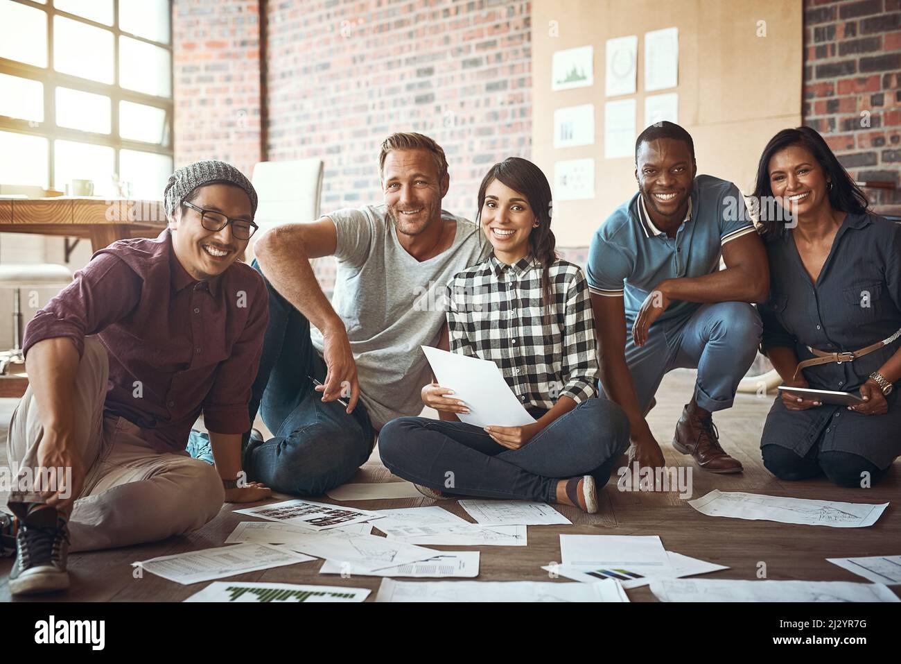 Alone we are one drop, together we are an ocean. Shot of a team of ...