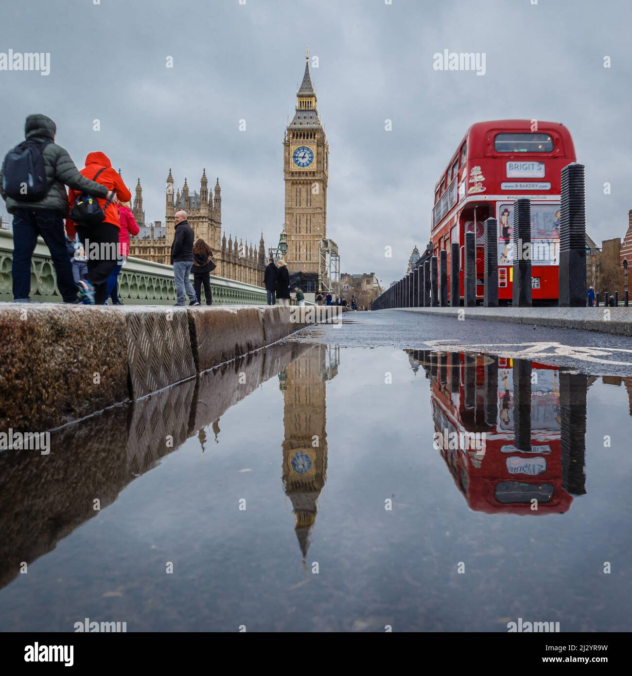 Westminster reflected in a puddle on Westminster Bridge, London Stock ...