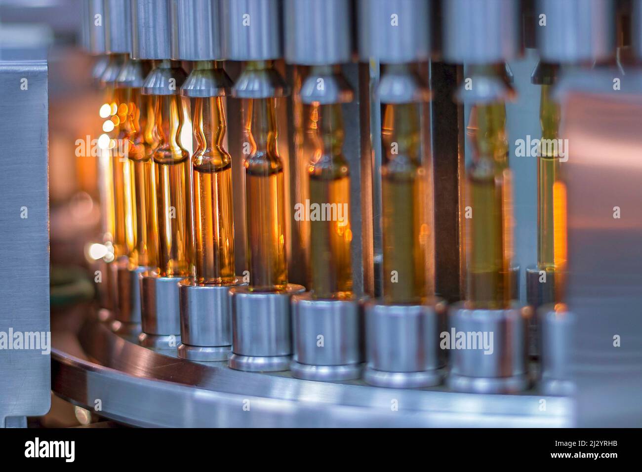 Inspects vials and ampules for particulates in liquid and container ...