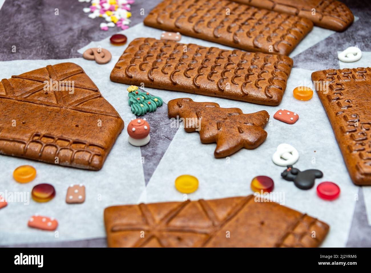 Gingerbread house parts and decorations on a gray background Stock ...