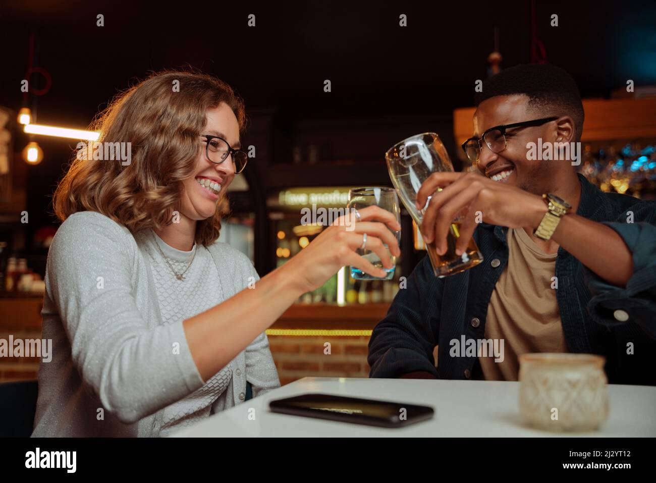 Friends sharing beer food table hi-res stock photography and images - Alamy