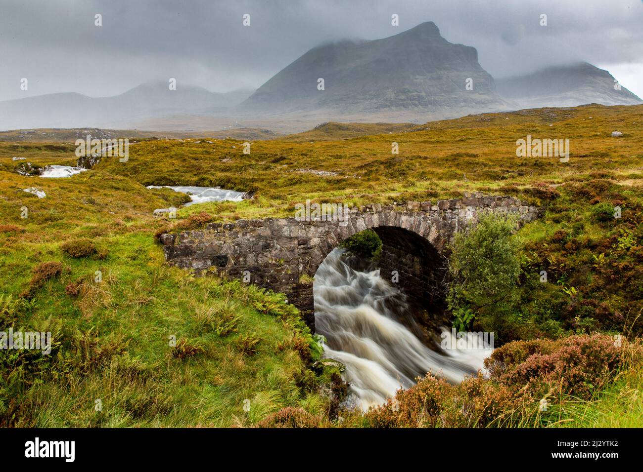 Quinag mountain range, old stone bridge in the Scottish Highlands ...