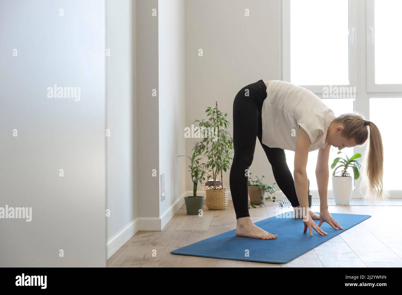 slim woman doing stretching exercise Stock Photo - Alamy