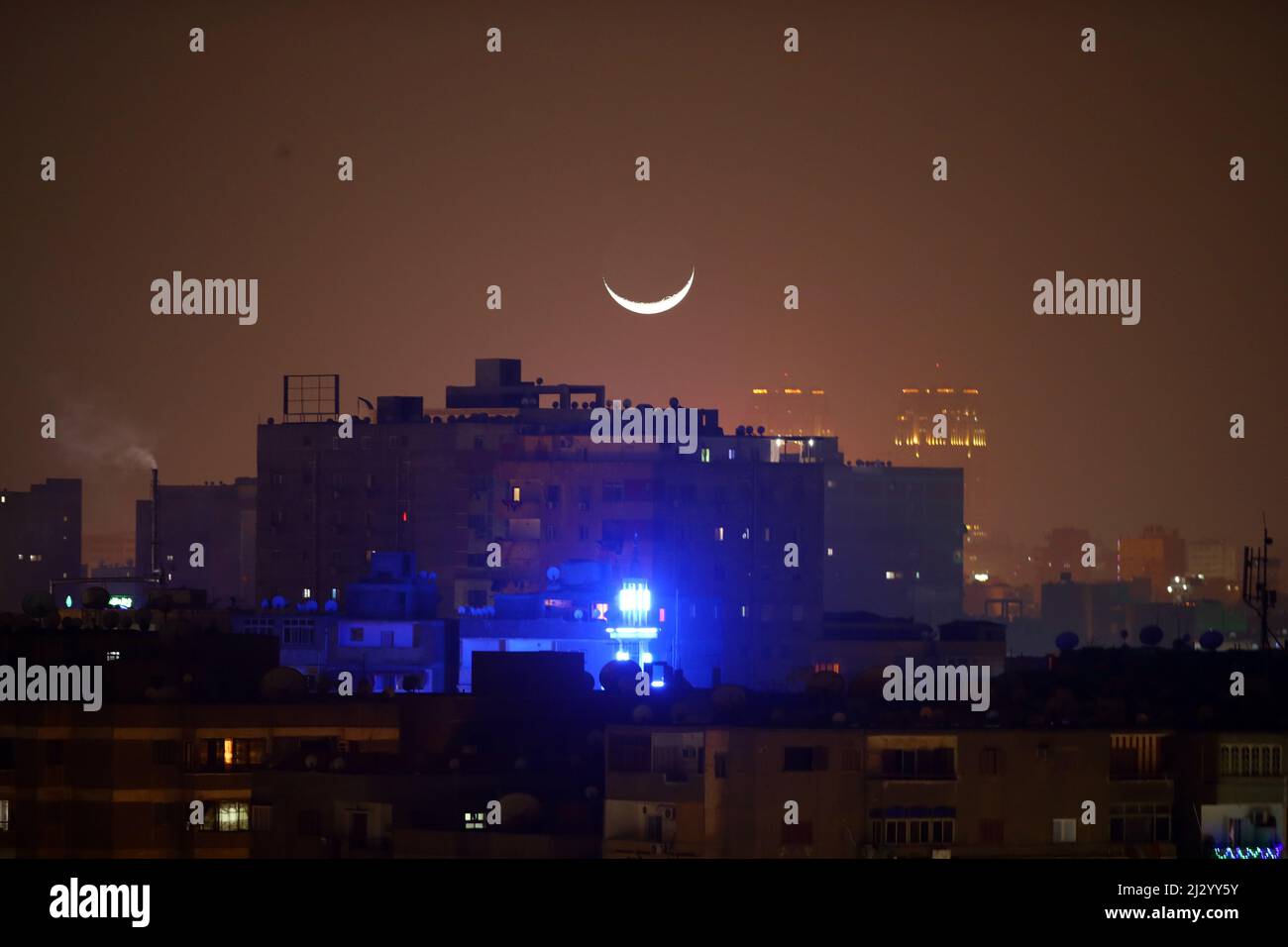 Cairo, Egypt. 4th Apr, 2022. A crescent moon is seen in the sky in ...