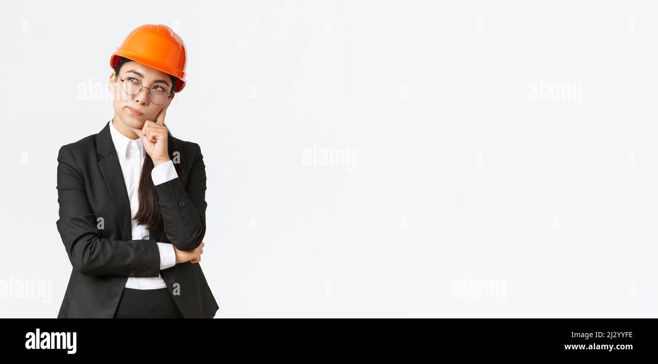 Thoughtful creative female asian chief architect, construction engineer ...