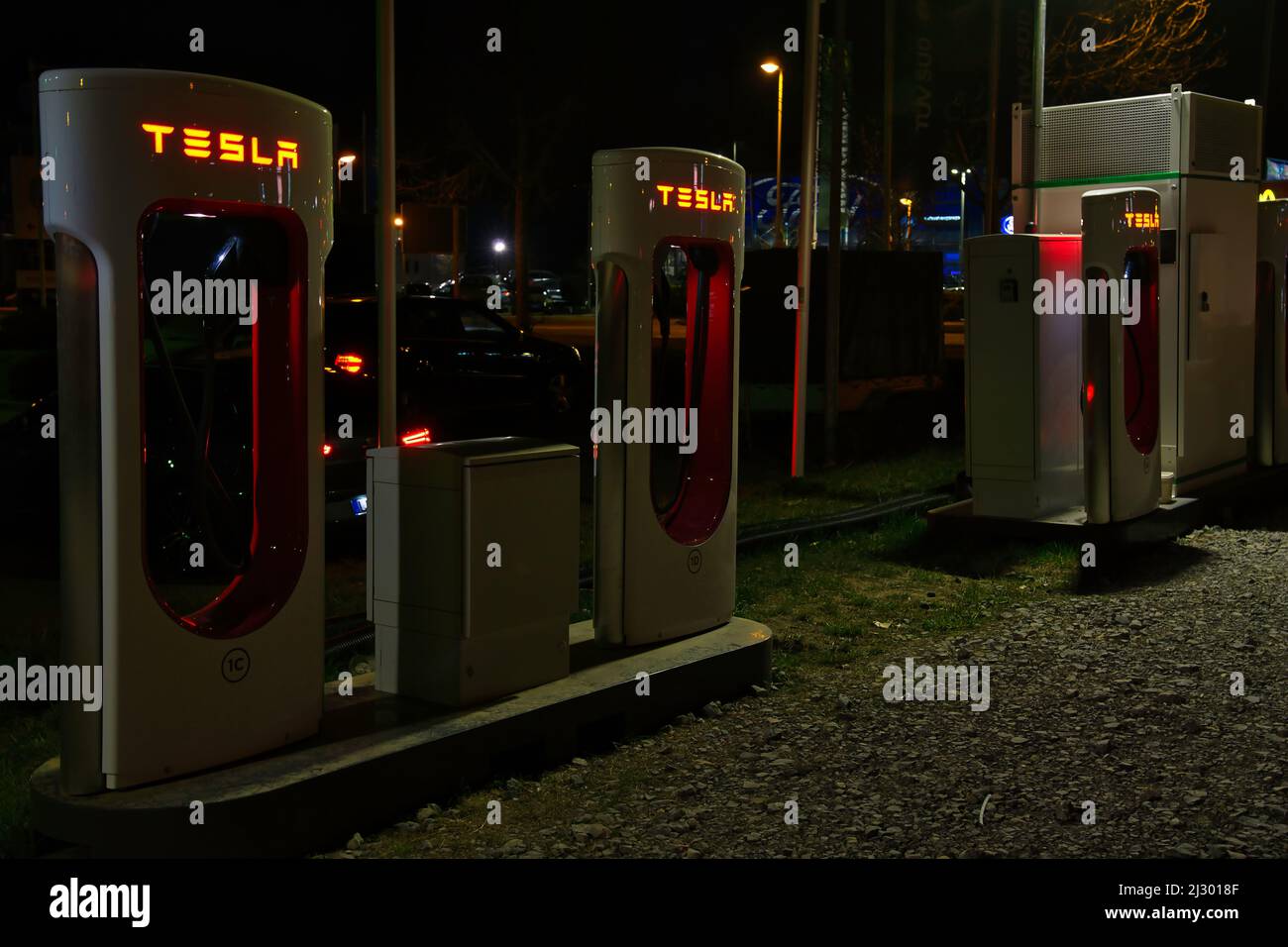 A Tesla charging station with logos and lights in Leonberg Germany at ...