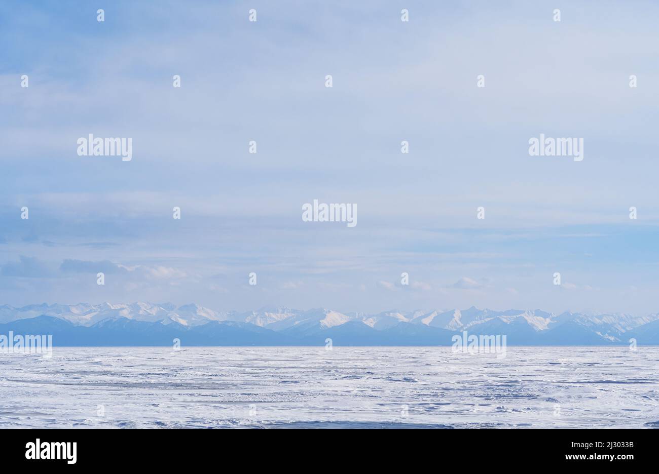 Winter landscape with mountains and Lake Baikal in Siberia at sunset ...