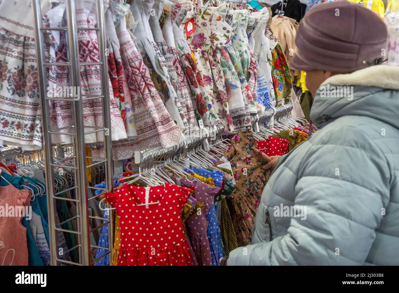 Moscow, Russia. 3rd of April, 2022. A woman looks at children's clothes ...