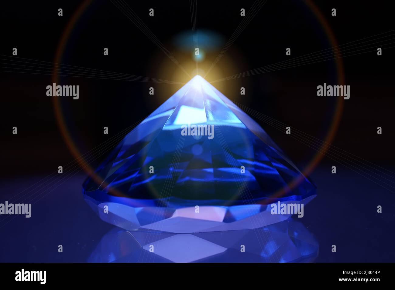 A close-up shot of a dark blue diamond on a black background Stock ...