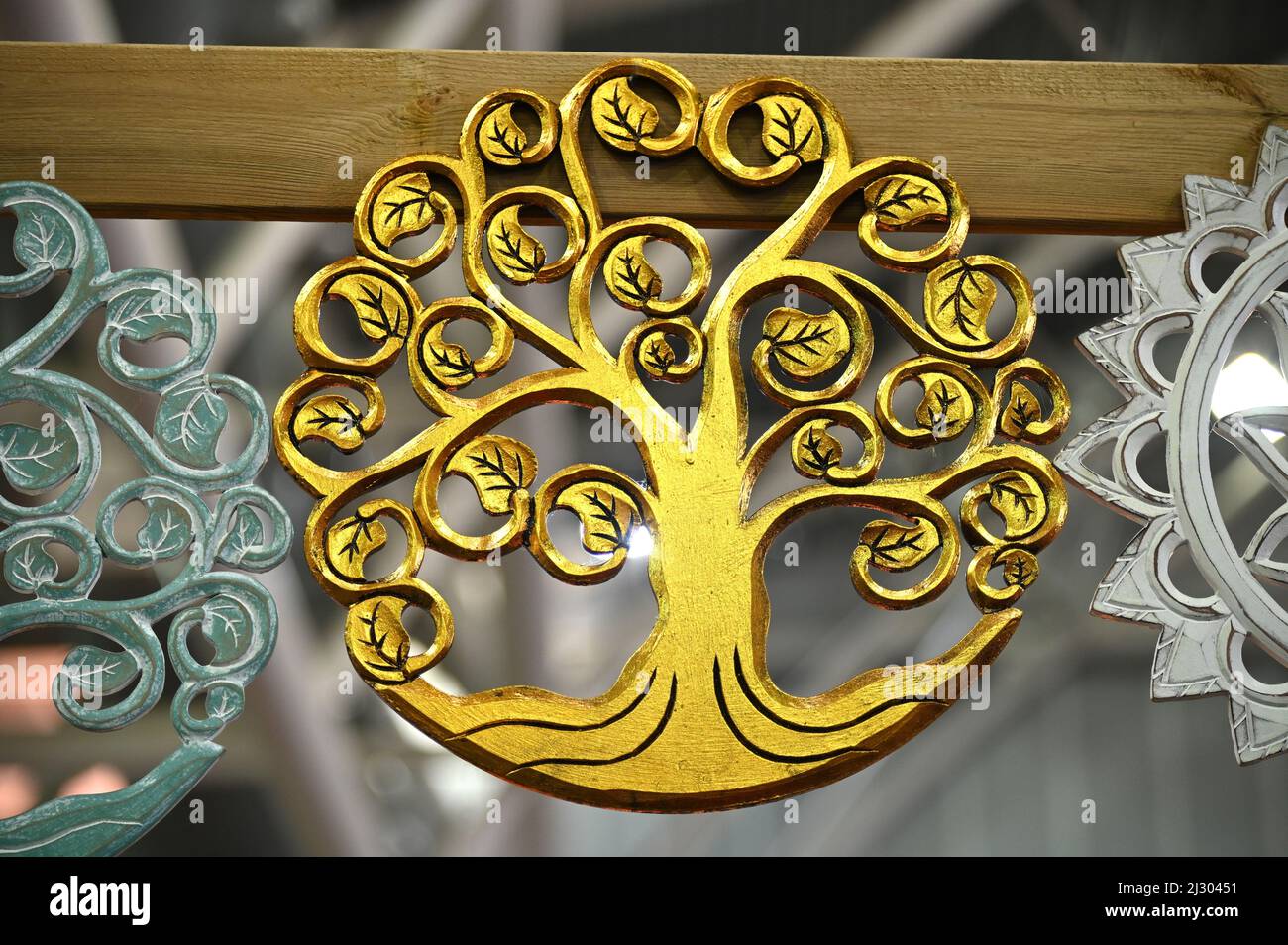 A close-up shot of a wooden gold tree symbol Stock Photo - Alamy