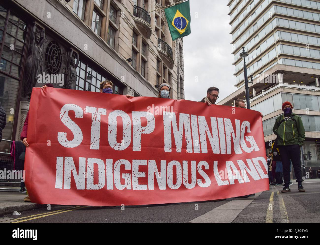 London, UK. 04th Apr, 2022. Protesters hold a 'Stop mining Indigenous ...