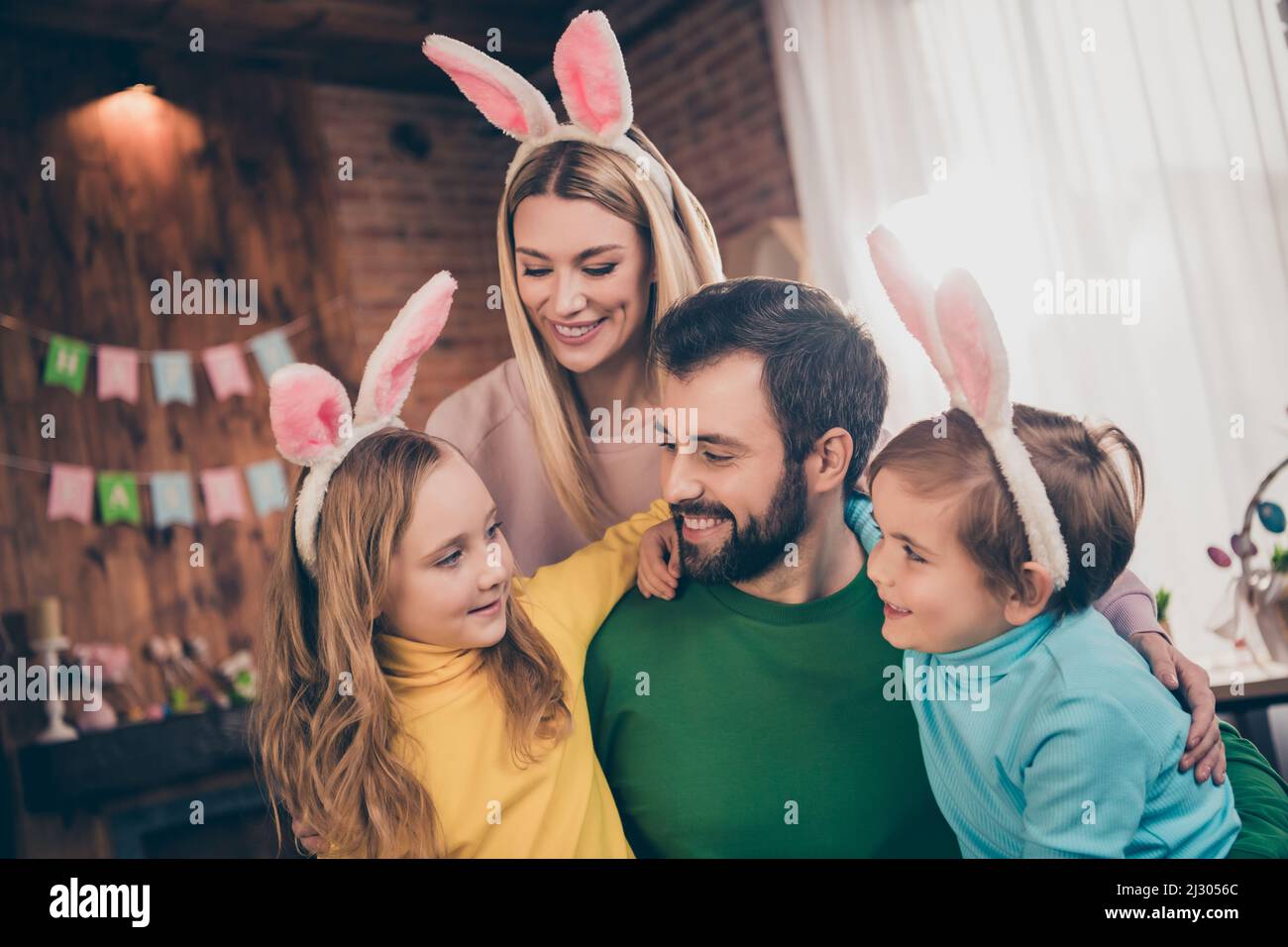 Portrait of attractive cheerful adorable family hugging having fun ...