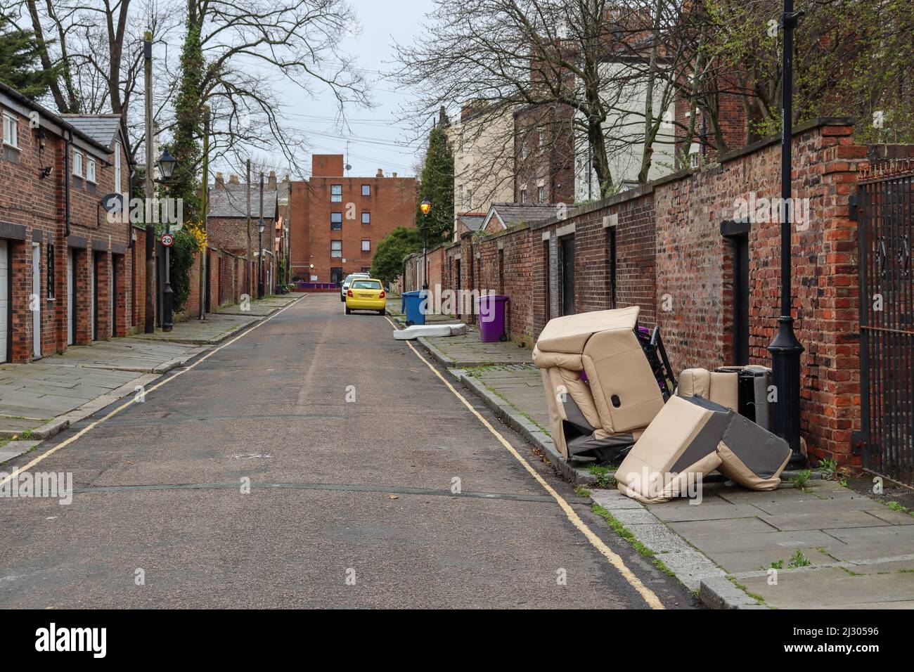 Sofa dumped on the street, fly tipping Stock Photo - Alamy