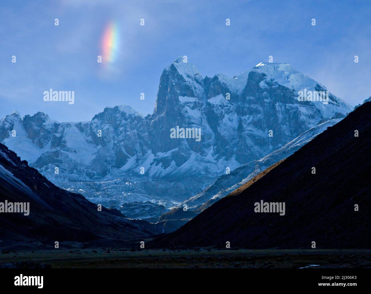 Sun Dog over Nevado Puscanturpa, Cordillera Huayhuash, Peru Stock Photo ...