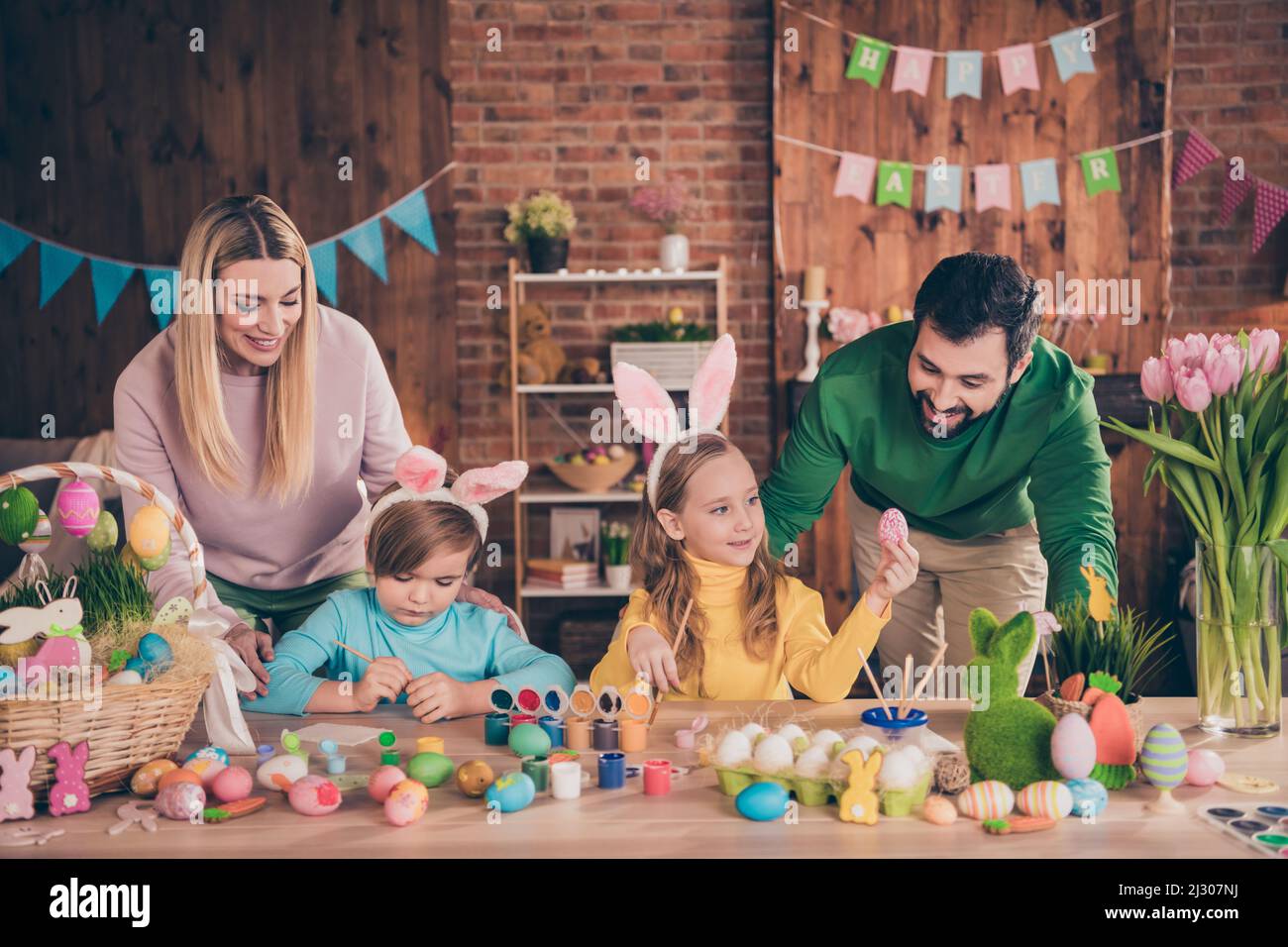 Photo of lovely young family spend time at home celebrate easter mom ...