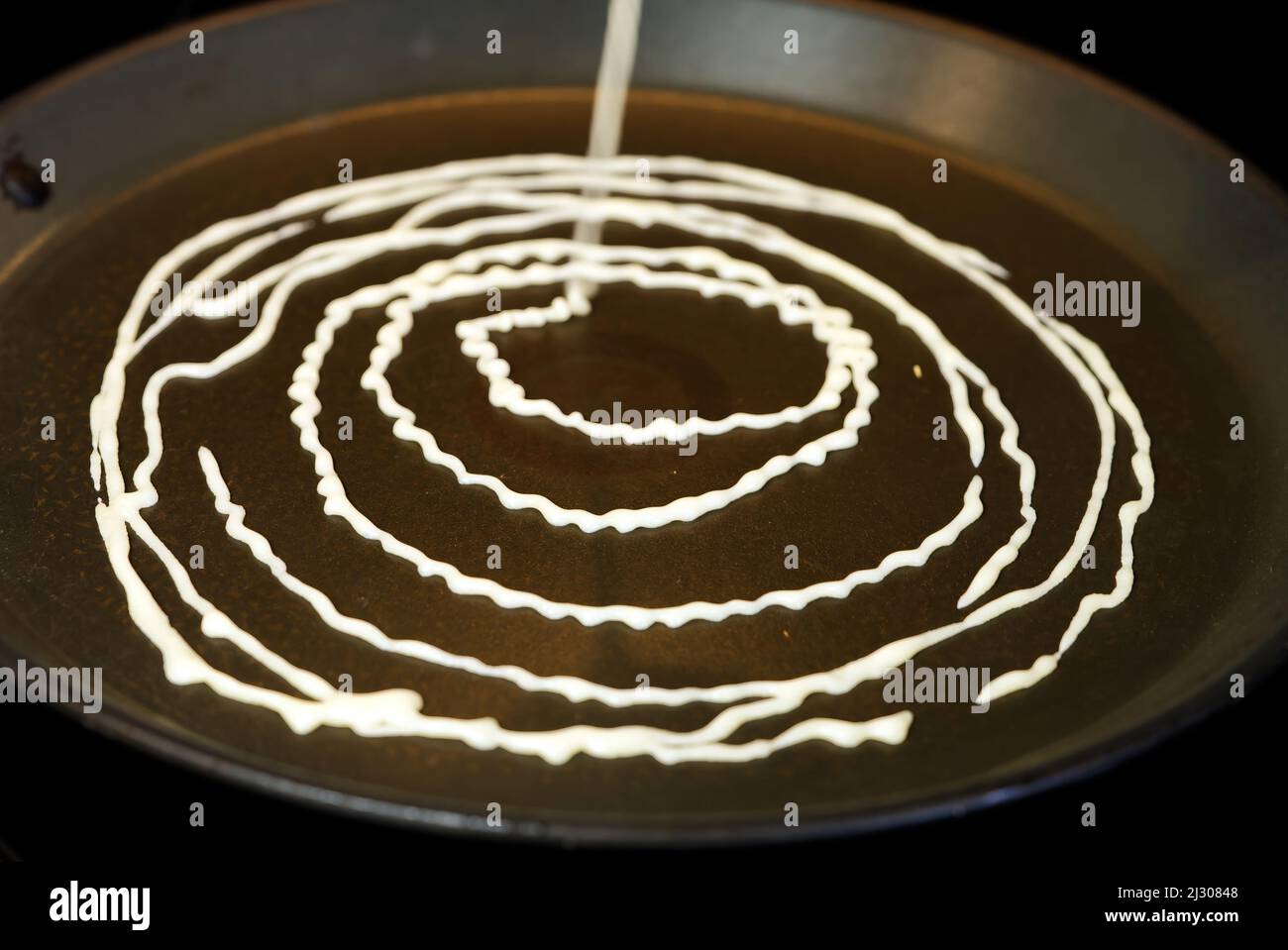 Malaysian woman cooking traditional food hi-res stock photography and ...
