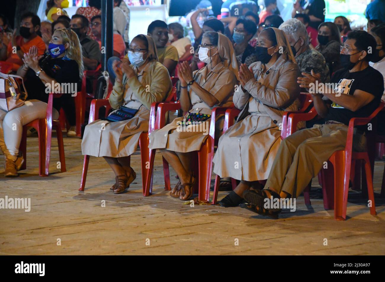Religious nuns enjoying an outdoor show, Merida Mexico Stock Photo - Alamy