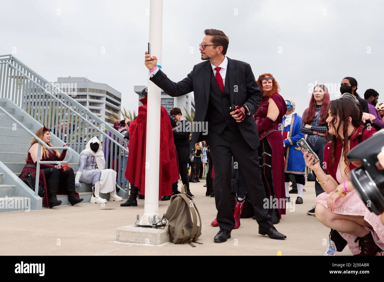 April 2, 2022: Tony Stark looking on a group Avengers photo shoot ...