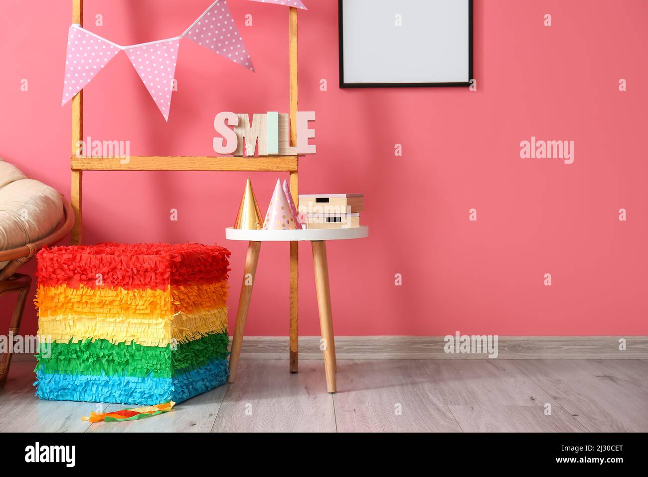 Interior of stylish room with Mexican pinata decorated for Birthday ...