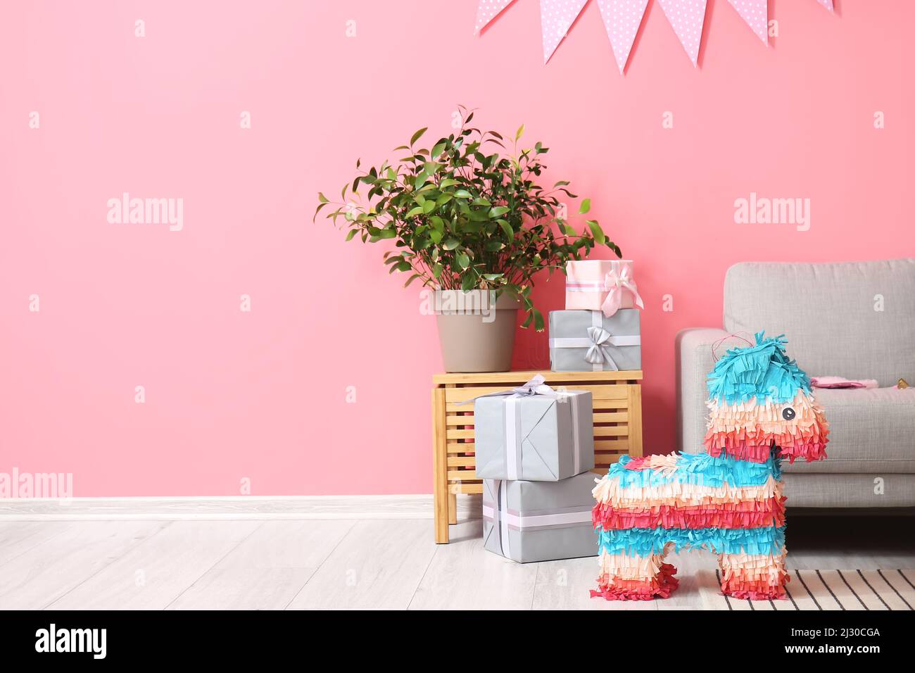 Mexican pinata in interior of living room decorated for Birthday party ...