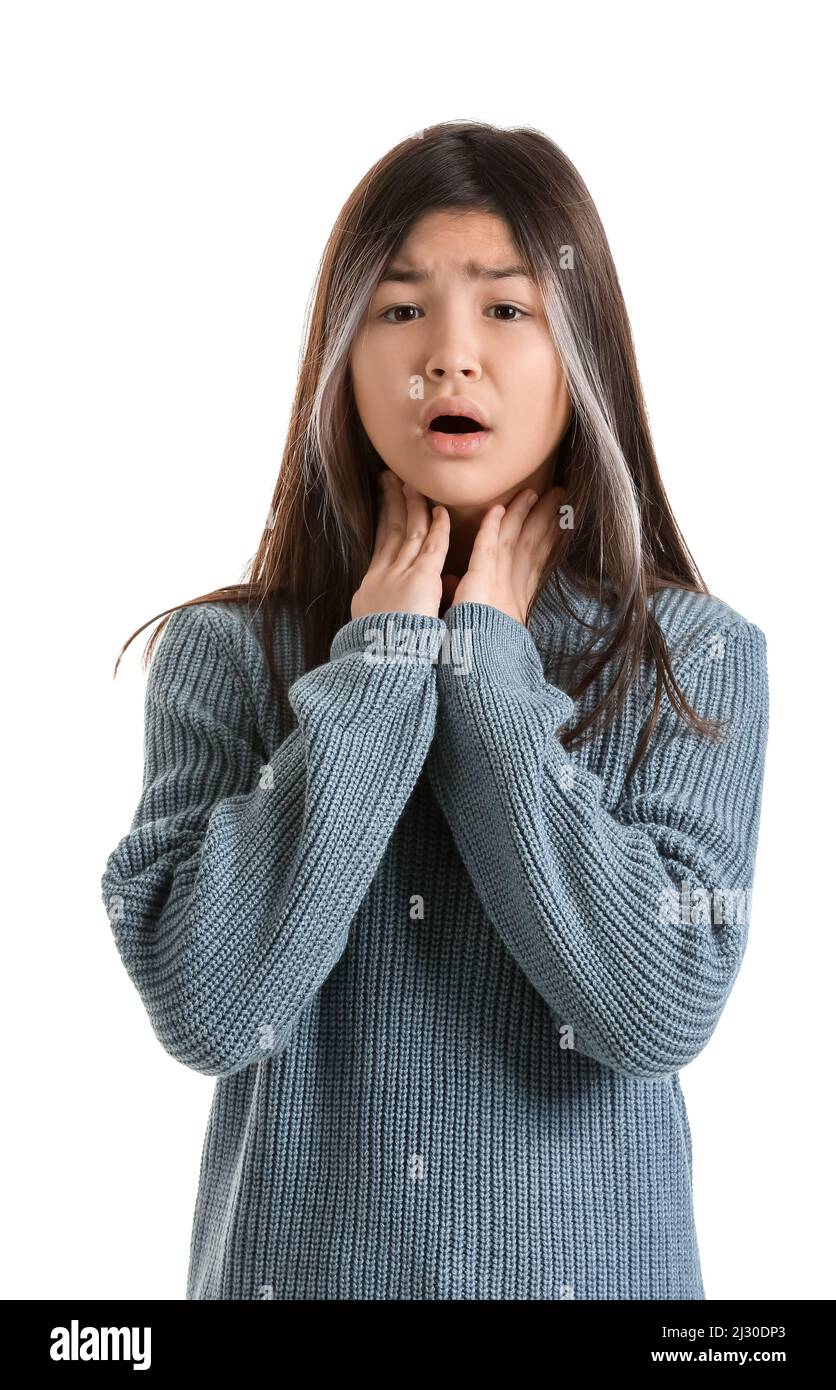 Ill Asian girl with sore throat on white background Stock Photo - Alamy