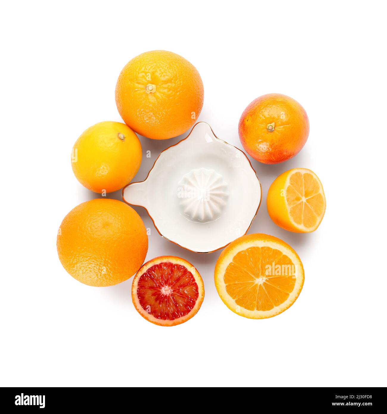 Ceramic juicer and citrus fruits on white background Stock Photo - Alamy