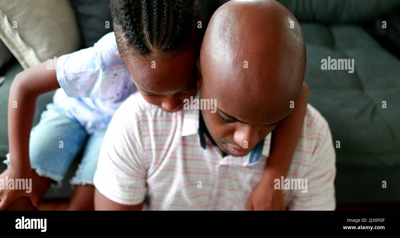Black father browsing internet on laptop with child son Stock Photo - Alamy