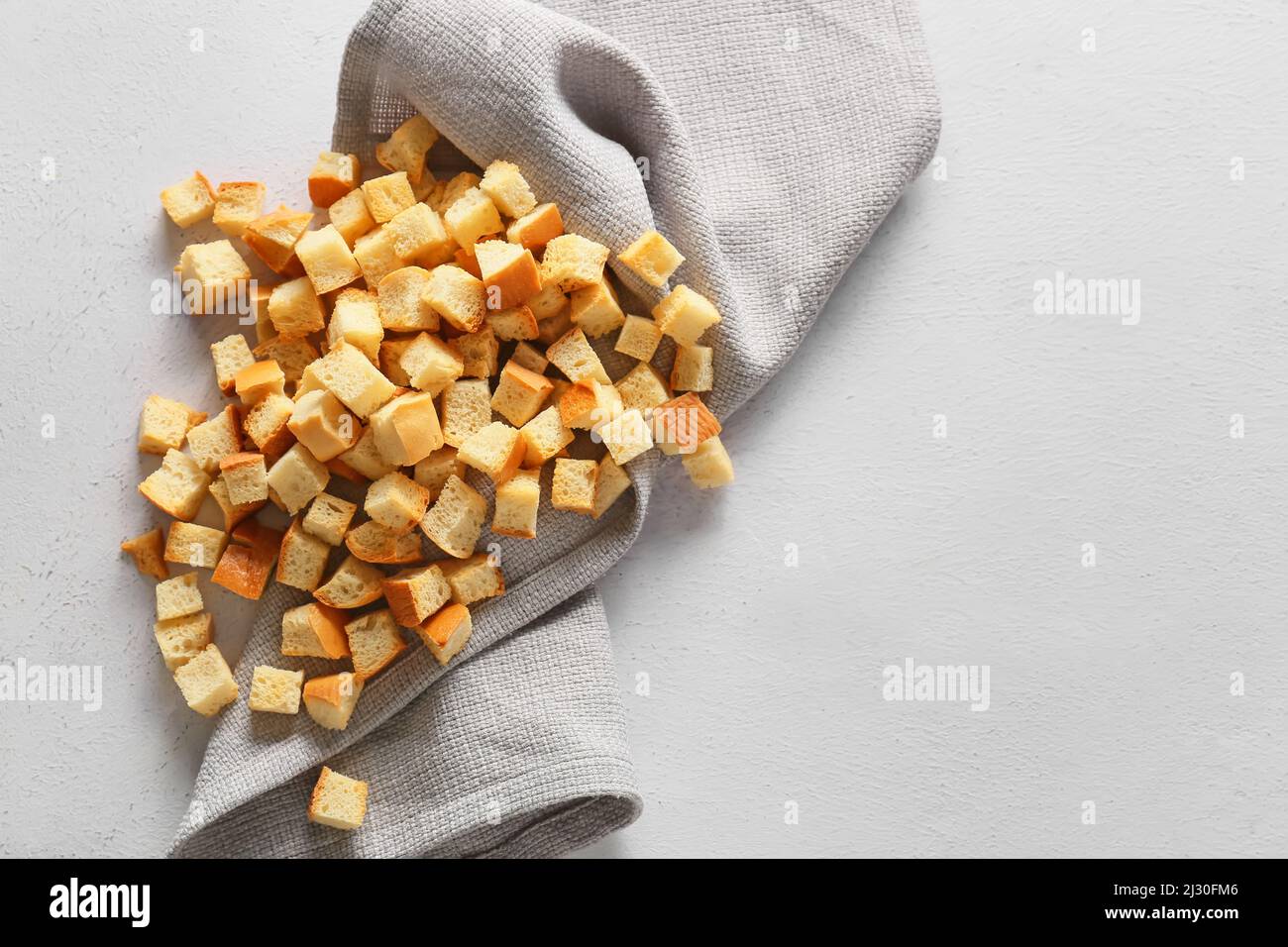 Many crunchy croutons on white background Stock Photo - Alamy