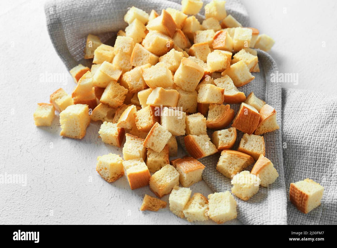 Many crunchy croutons on white background Stock Photo - Alamy