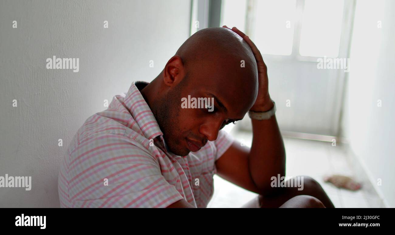Pensive african man working hi-res stock photography and images - Alamy