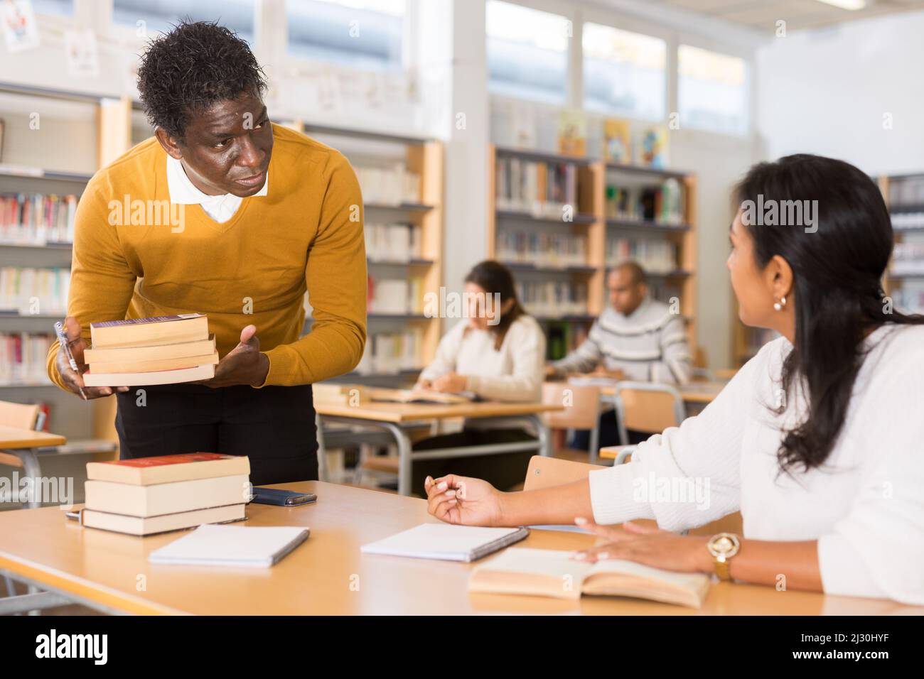 Male librarian book hi-res stock photography and images - Alamy