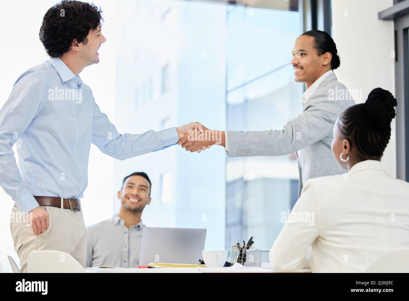 Combining talent with teamwork gets results. Shot of a group of people ...