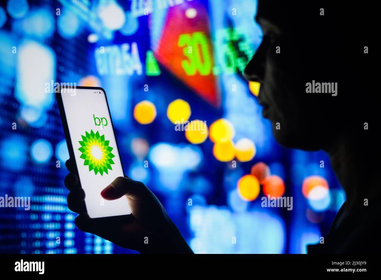 In this photo illustration, a woman's silhouette holds a smartphone ...