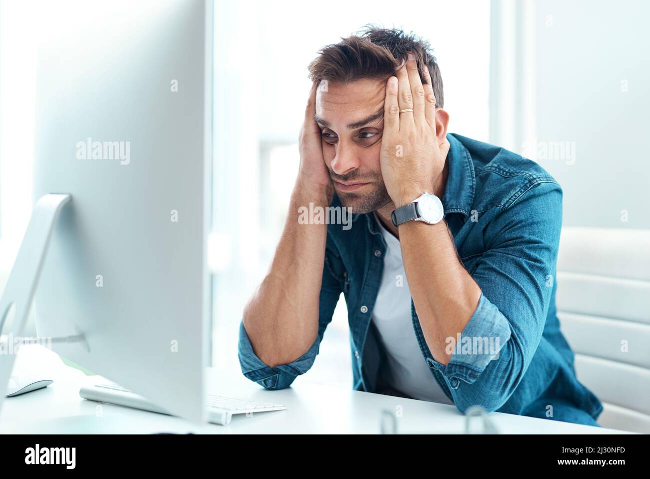 This whole situation is driving me crazy. Shot of a young businessman ...