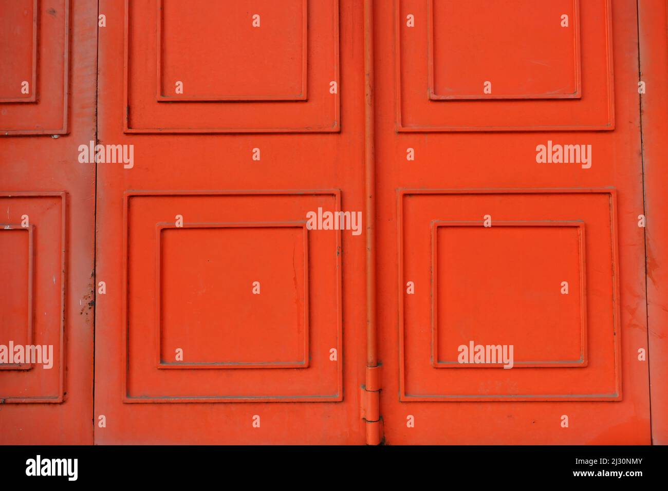 A rustic, red gate background with square patterns Stock Photo - Alamy