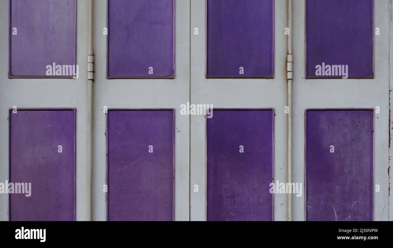 An old, rustic wall background with purple rectangles Stock Photo - Alamy