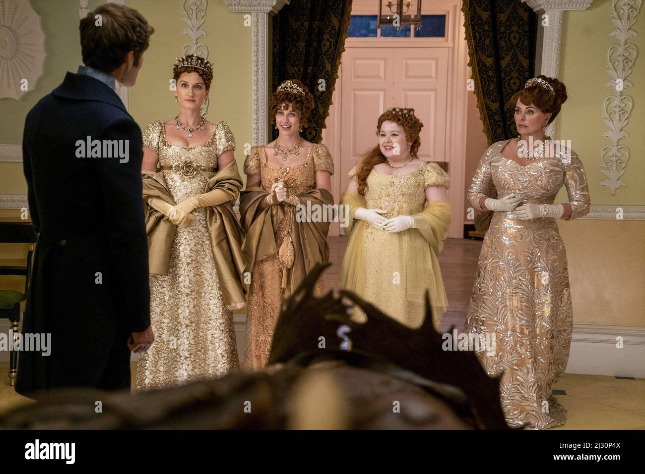 BRIDGERTON, from left: Rupert Young (back to camera), Bessie Carter ...