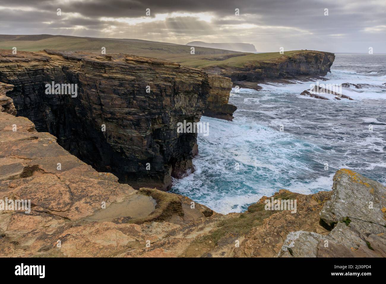Storm, surf breaker, sandstone cliffs of Yesnaby, clusters of rays ...