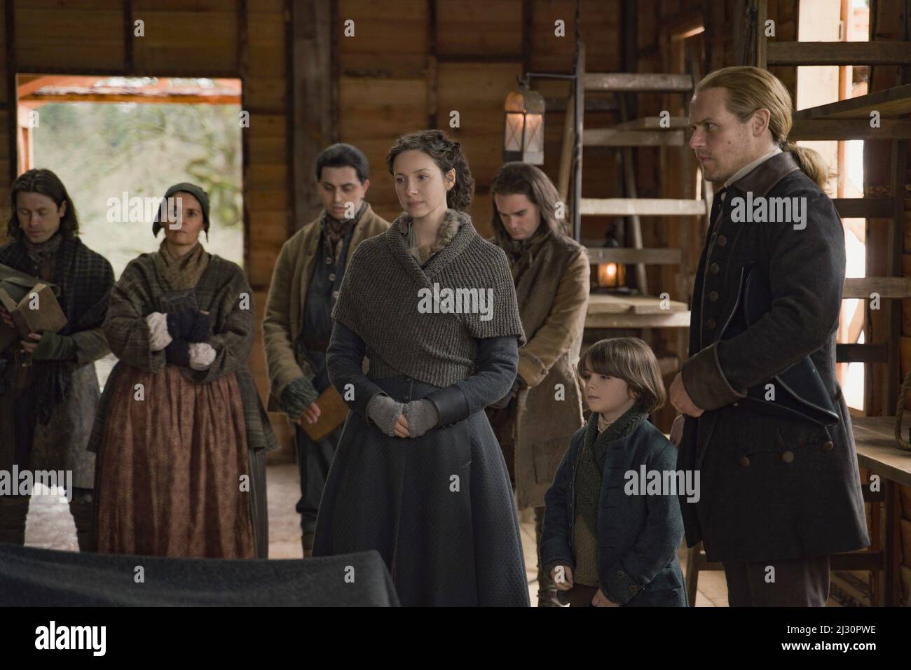 OUTLANDER, front, from left: Caitriona Balfe, Robin Scott, Sam Heughan ...