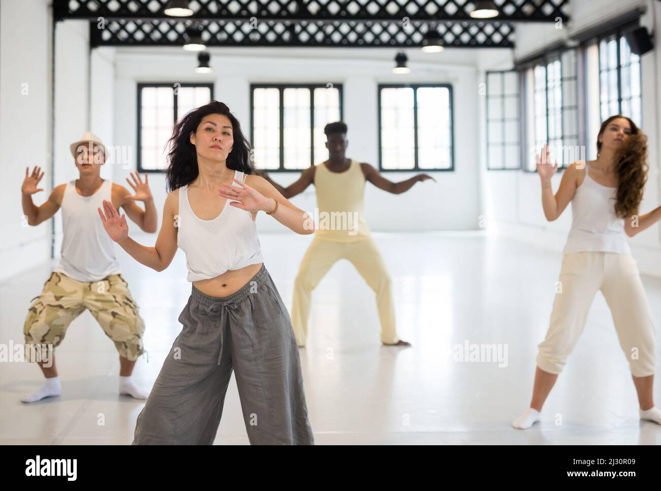 Group of people enjoying dancing together in studio Stock Photo - Alamy
