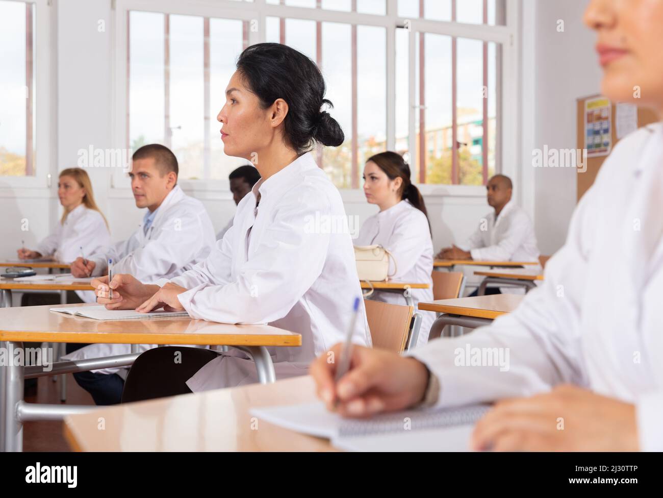 Confident asian female doctor listening refresher course Stock Photo ...