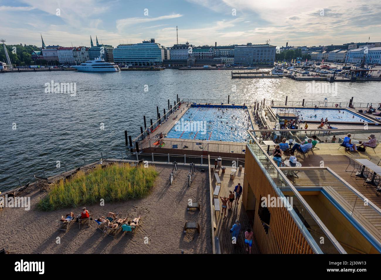 Allas Sea Pool, people bathing in the pool embedded in the harbor basin ...